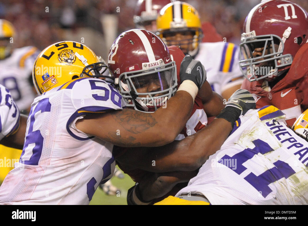 Alabama running back, #22 Mark Ingram, is wrapped up by #56 Perry Riley ...