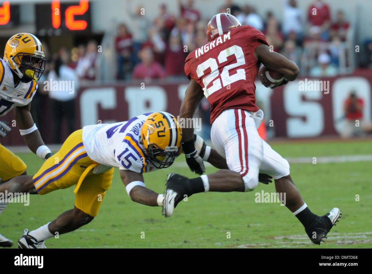 Alabama running back, #22 Mark Ingram, eludes a tackle by LSU defender ...