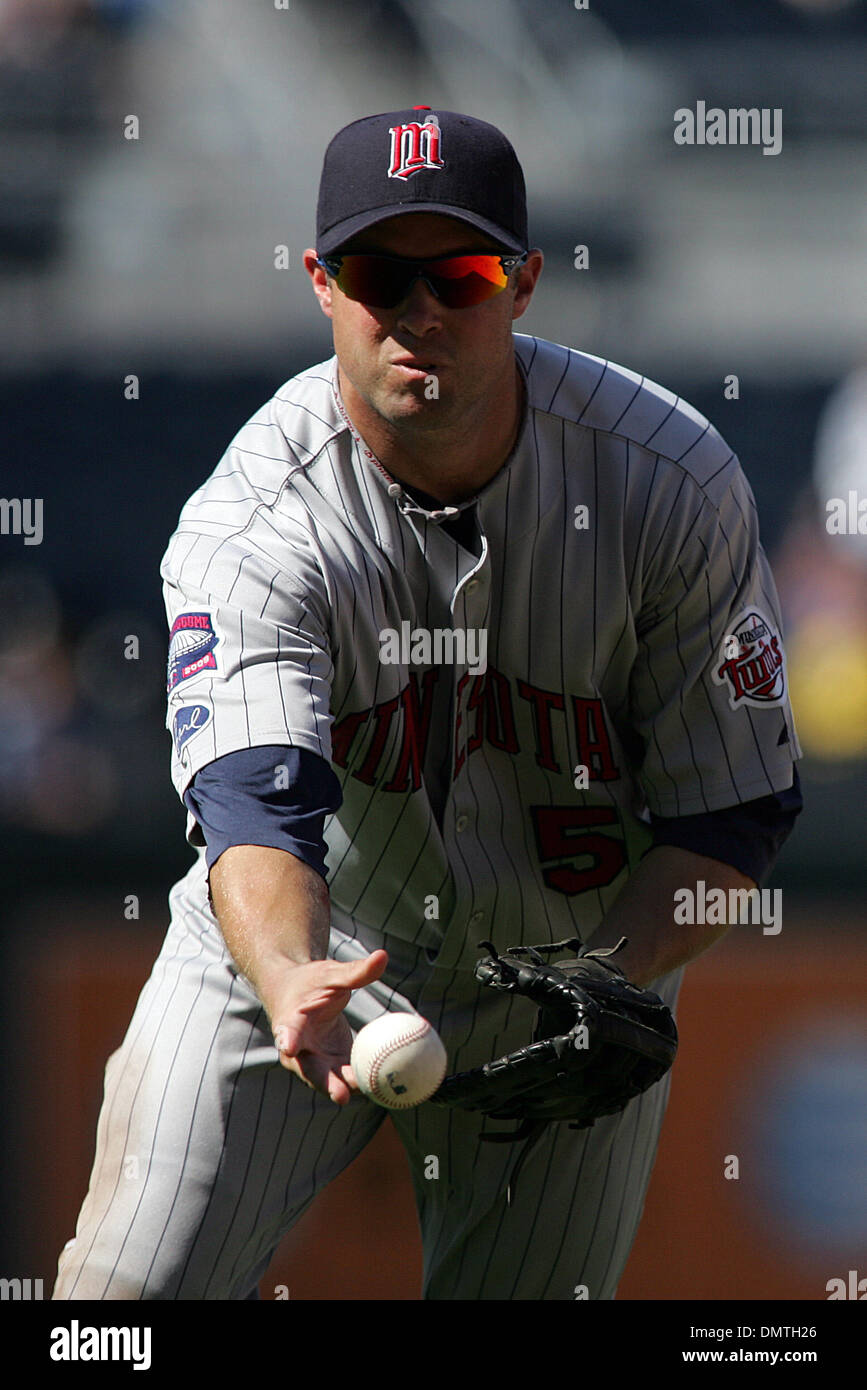 Minnesota Twins first baseman Michael Cuddyer fields a ground ball from ...