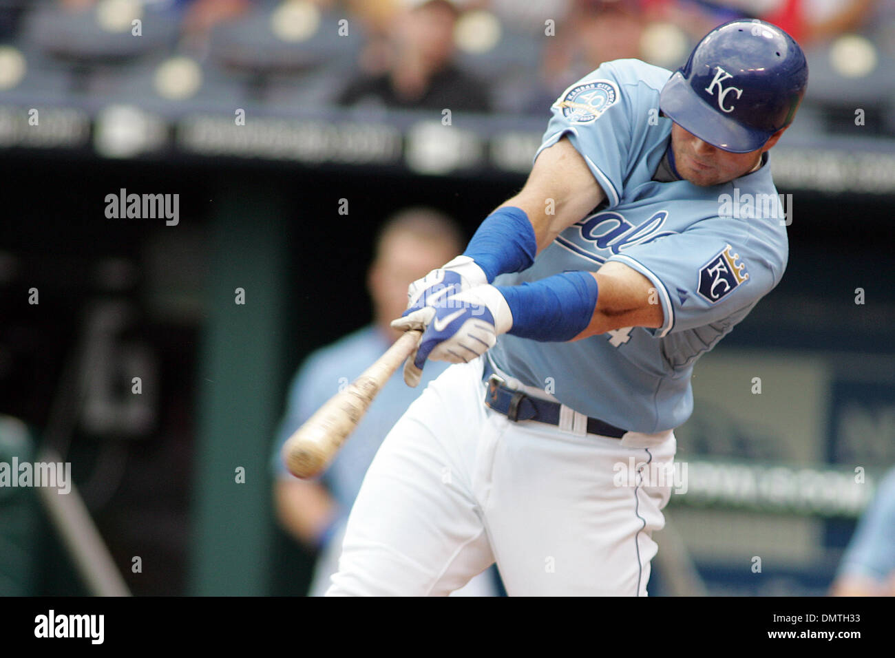Kansas City Royals third baseman Mark Teahen sends a sacrifice fly to ...