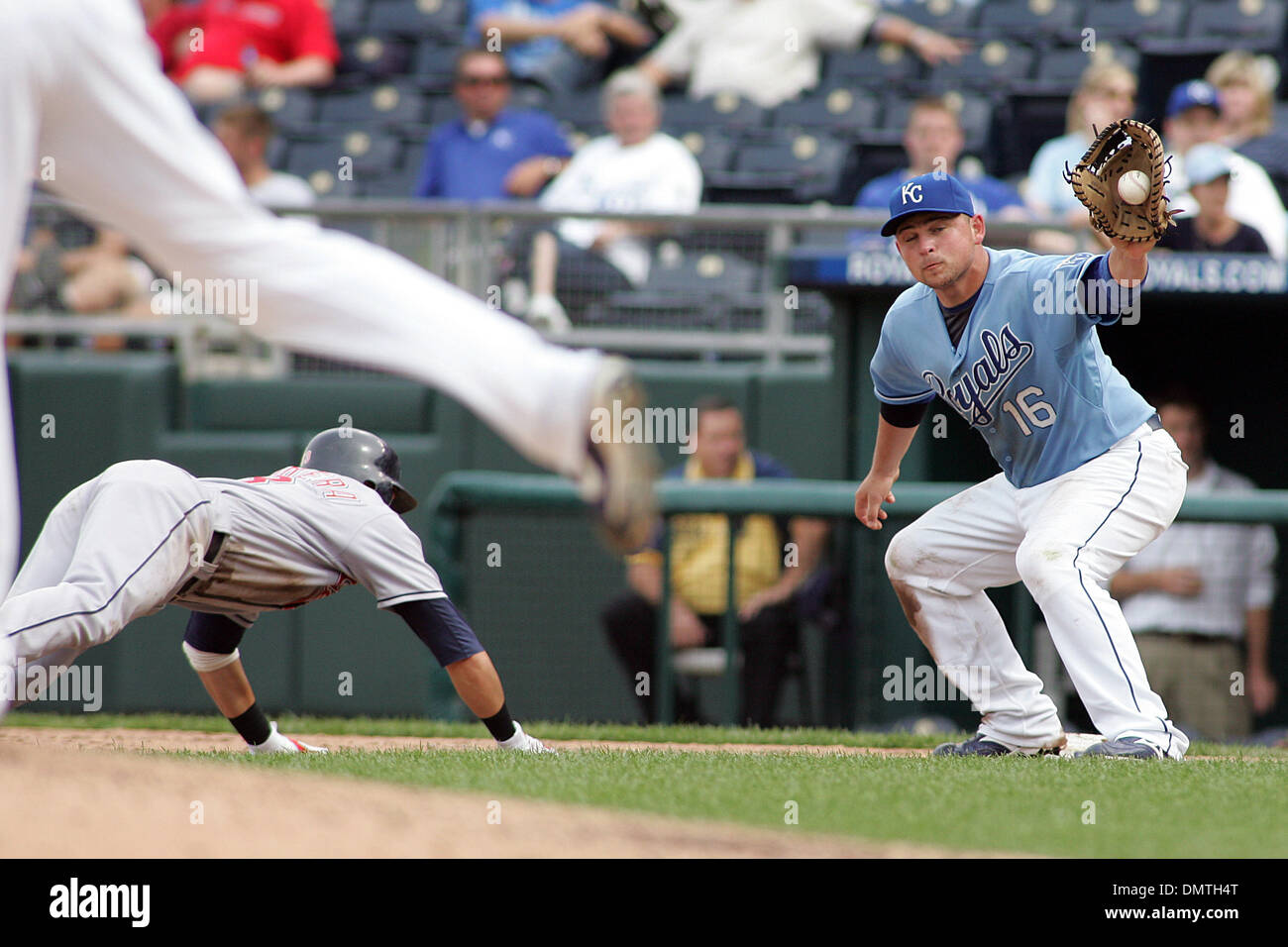 Kansas City Royals first baseman Billy Butler attempts to tag Cleveland ...