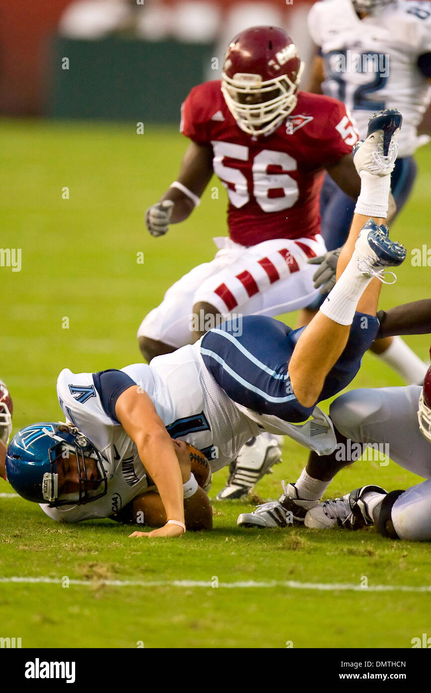 Villanova Wildcats quarterback Christopher Whitney #17 goes down as ...