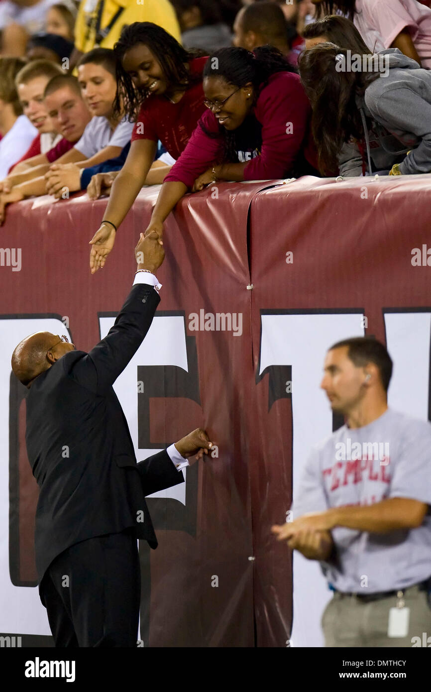 Philadelphia Mayor Michael Nutter shaking hands with fans in the stands ...