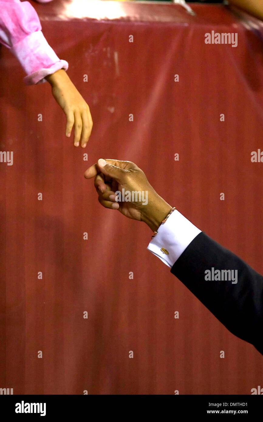 Philadelphia Mayor Michael Nutter reaching out to a young girl in the ...