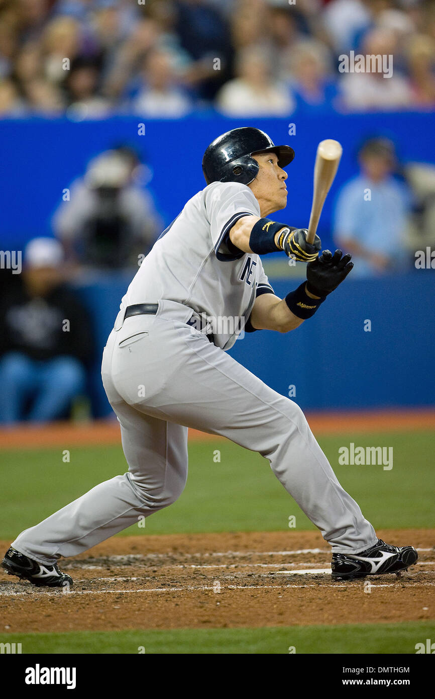 New York Yankees designated hitter Hideki Matsui #55 watches a fly ball ...