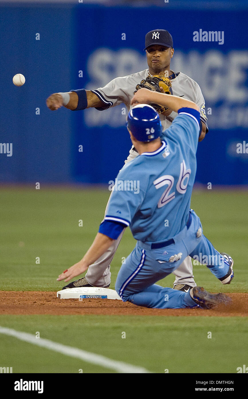 Toronto Blue Jays designated hitter Adam Lind #26 is out in a double ...