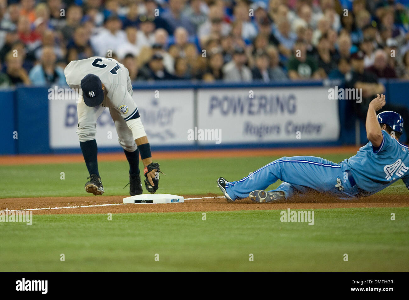 New York Yankees third baseman Alex Rodriguez #13 tags the bag at third ...