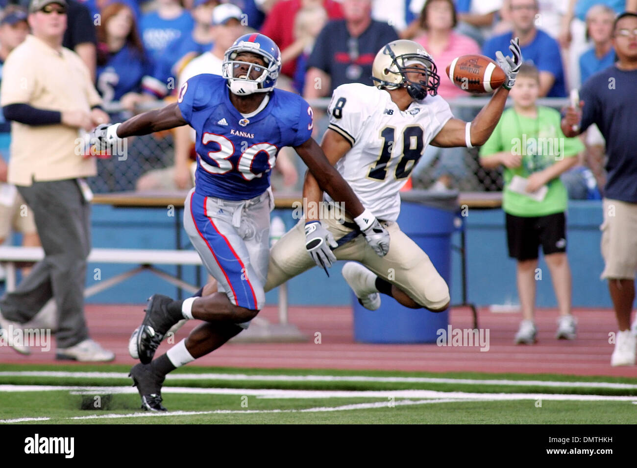 Northern Colorado wide receiver Alex Thompson (18) is covered by Kansas ...