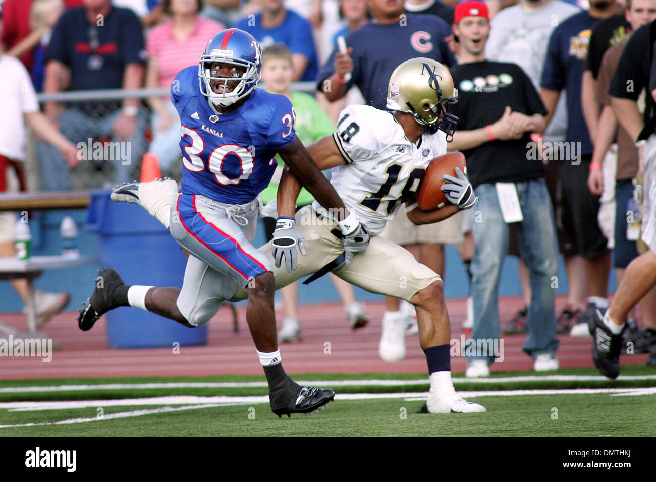 Northern Colorado wide receiver Alex Thompson (18) is covered by Kansas ...