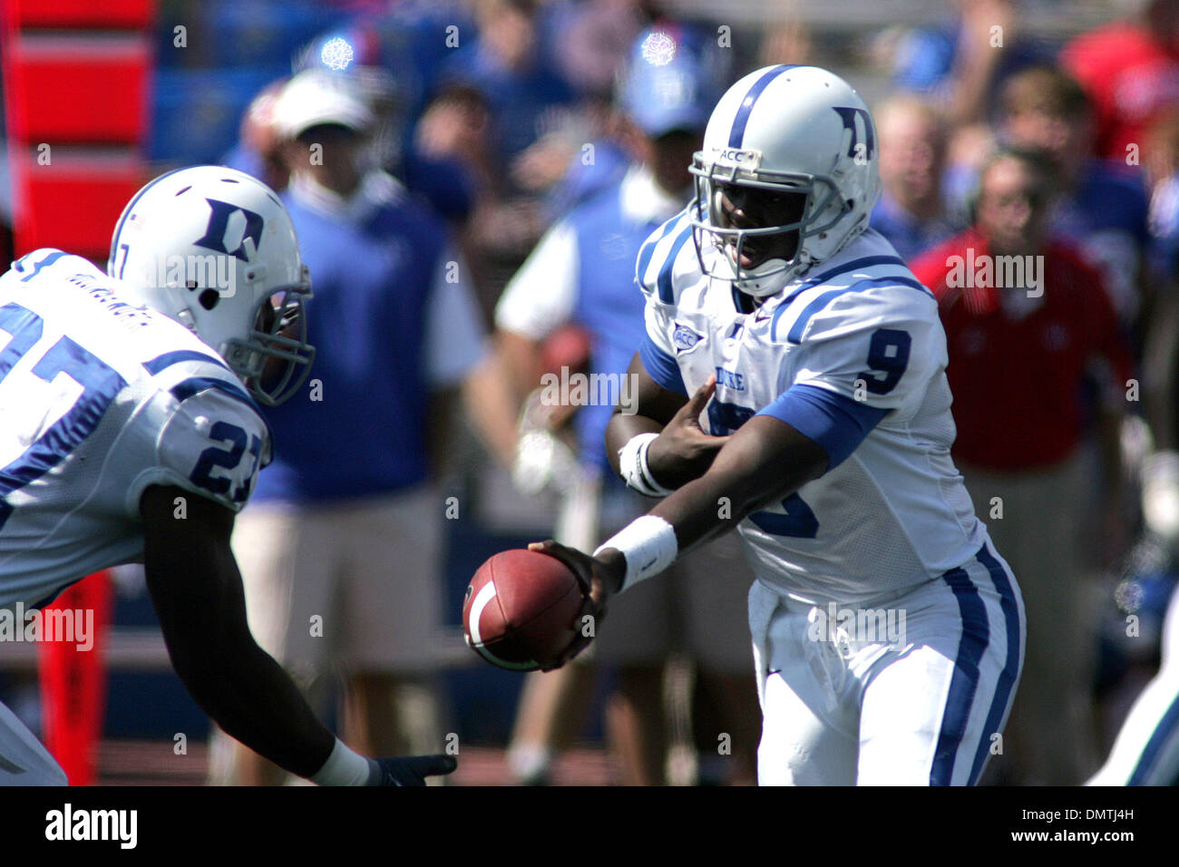 Duke quarterback Thaddeus Lewis (9) hands off to Duke running back Jay ...