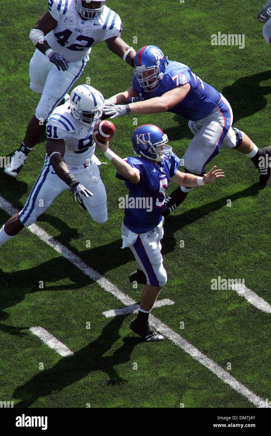 Kansas quarterback Todd Reesing (5) passes under pressure from Duke ...