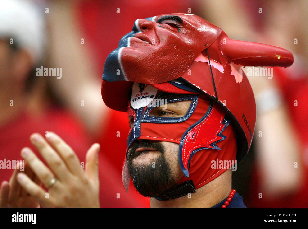 Houston Texans fan wearing a a mask, a devil face, and a horn hat. The ...