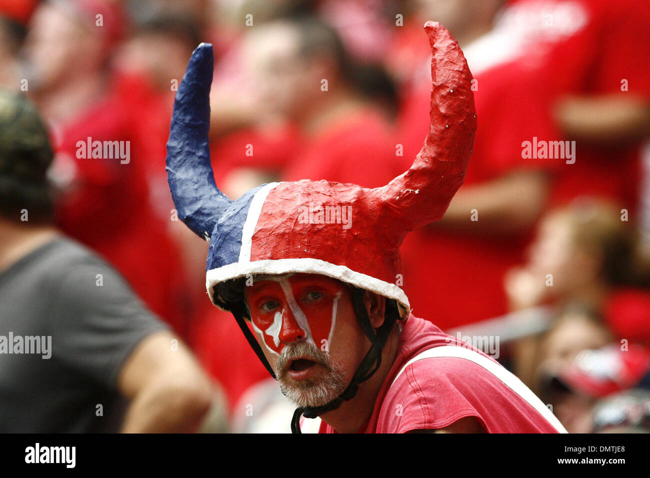 Houston Texans fan looks on in dismay, wearing a giant pair of horns ...