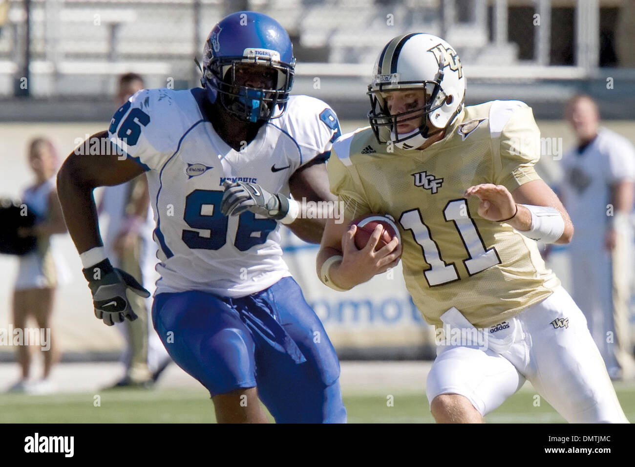 UCF Knights Quarterback Brett Hodges eludes Memphis Tiger Jada Brown in ...