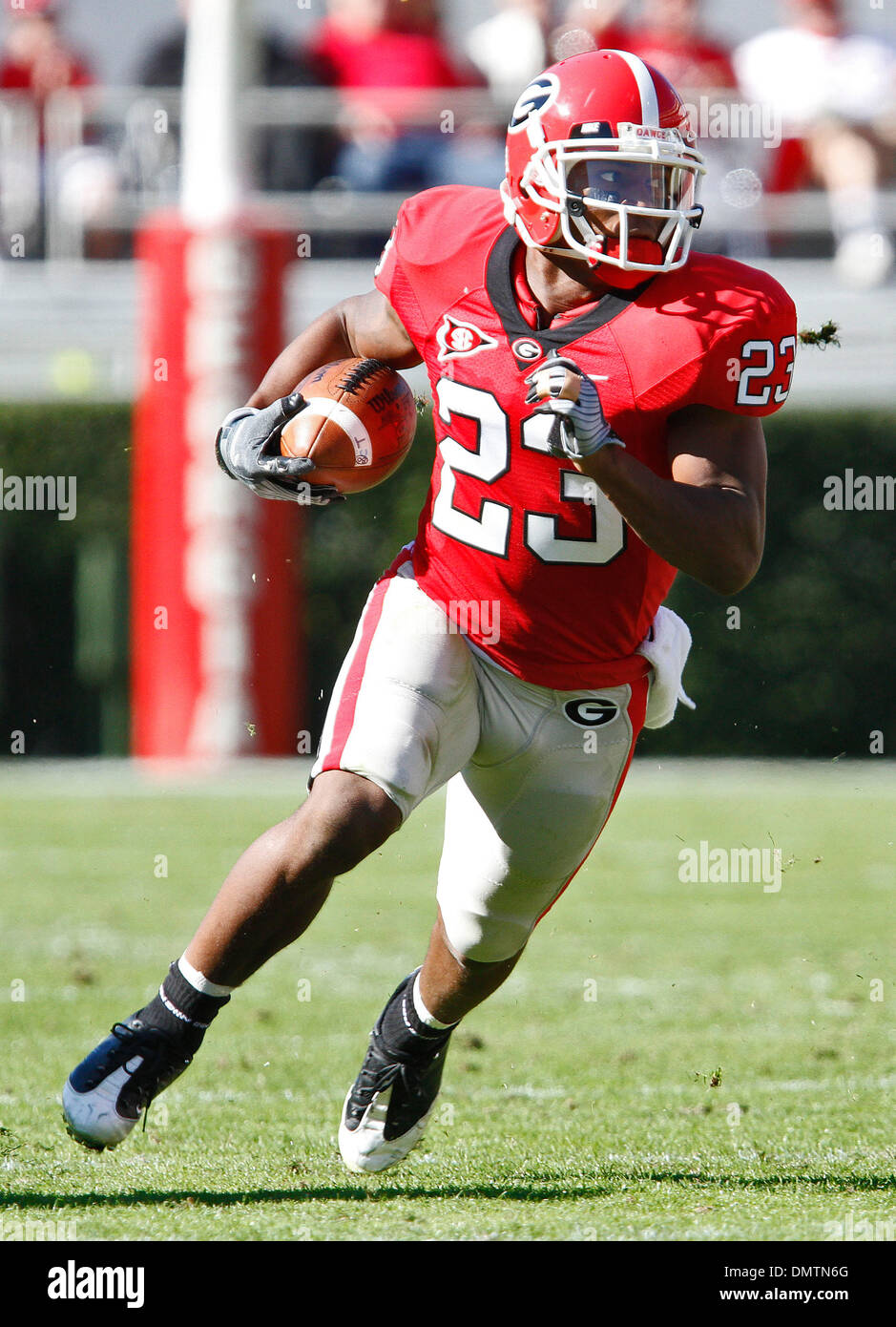 Georgia senior Prince Miller (23) returns a punt in the game against ...