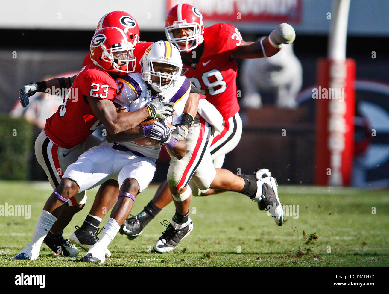 Georgia senior cornerback Prince Miller (23) tackles Tennessee Tech ...