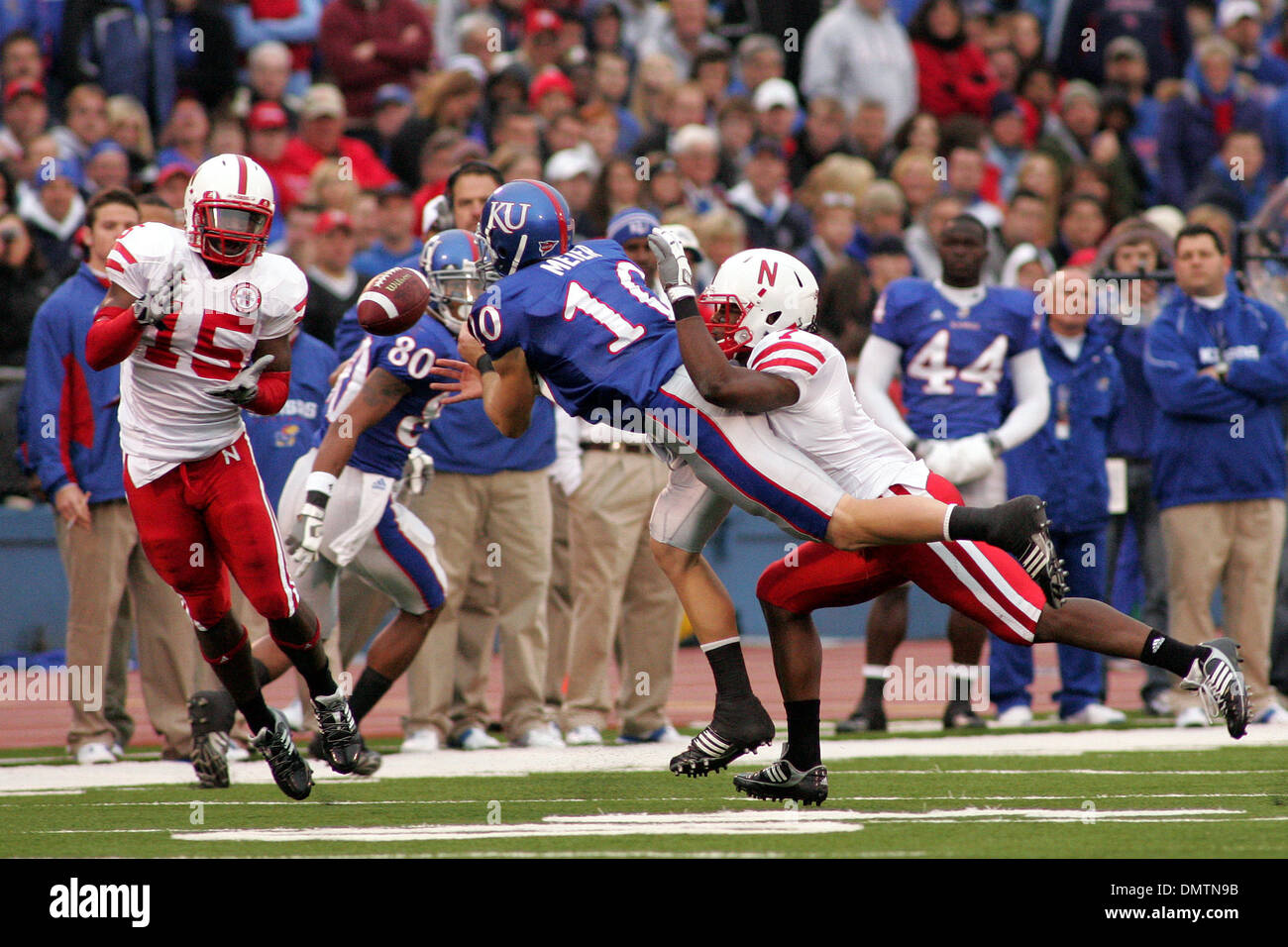 Kansas wide receiver Kerry Meier (10) dives for a pass with coverage ...
