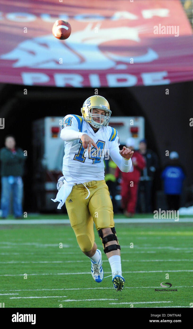 UCLA's Kevin Price rolls out for a pass during the first half of a NCAA ...