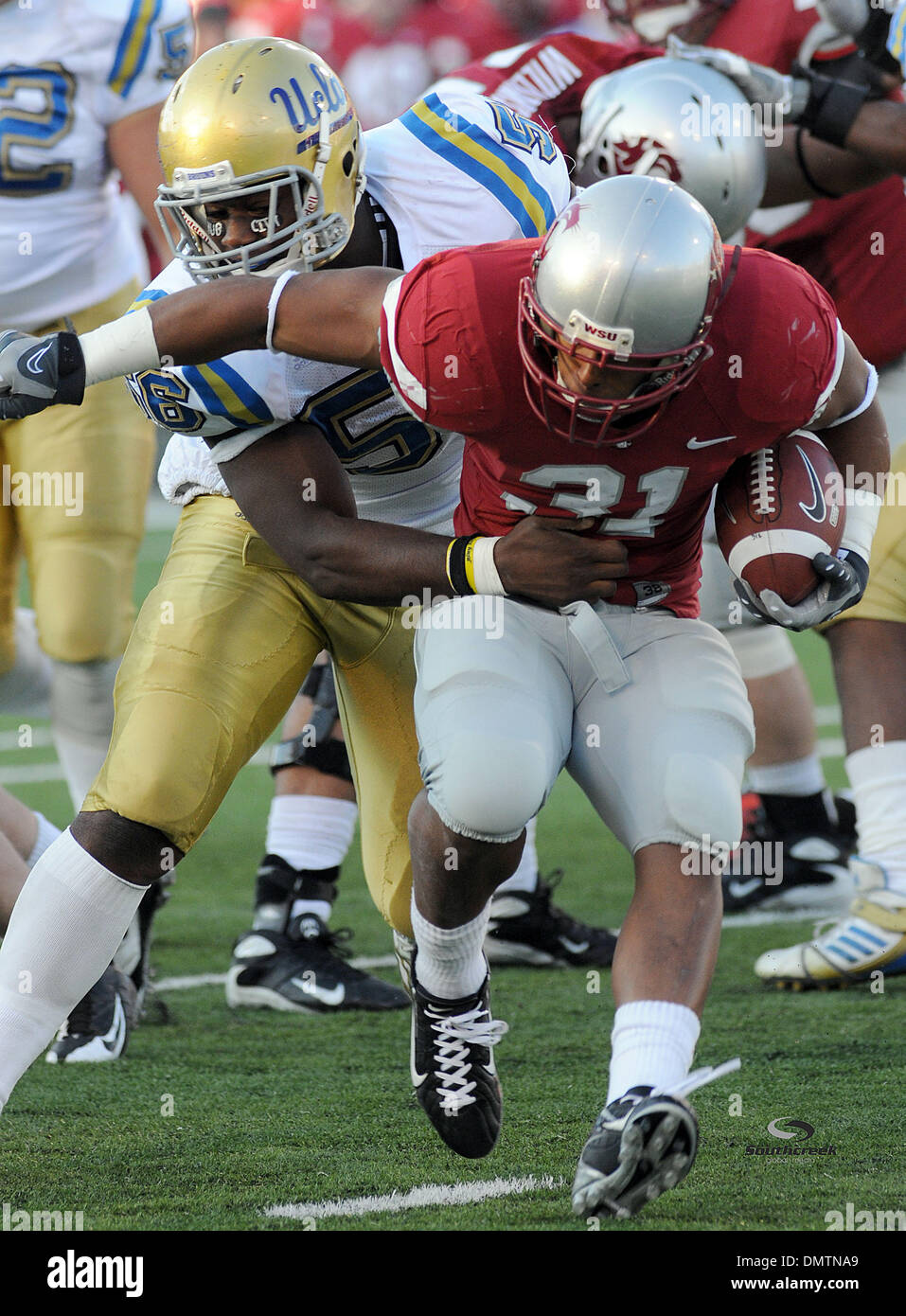 Washington St Dwight Tardy (32) is stopped short of a first down by ...
