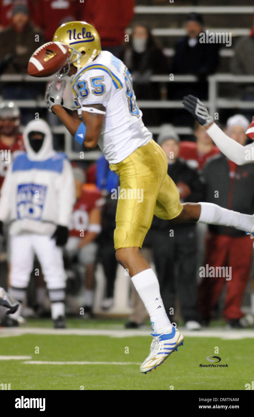 UCLA's Jerry Johnson is unable to make a clean catch after the ball ...