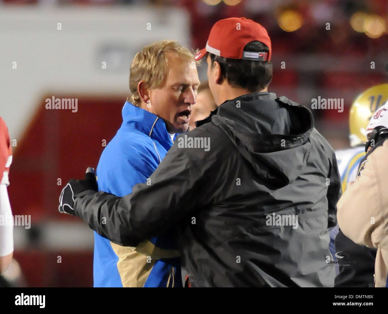 UCLA head coach Rick Neuheisel and Washington St head coach Paul Wulff ...