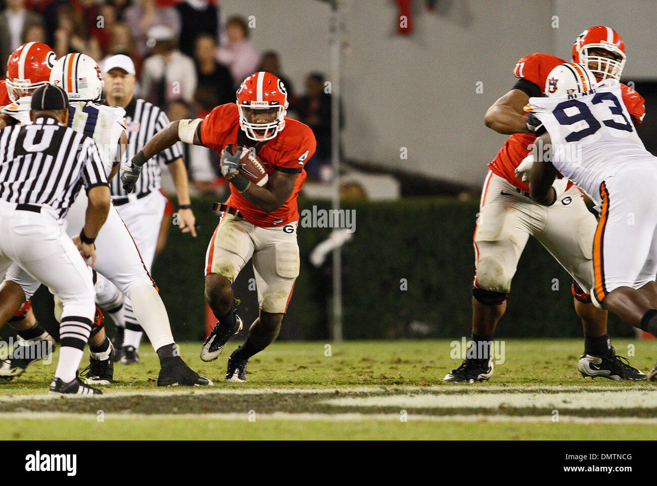 Georgia running back Caleb King (4) runs through a hole at the game ...
