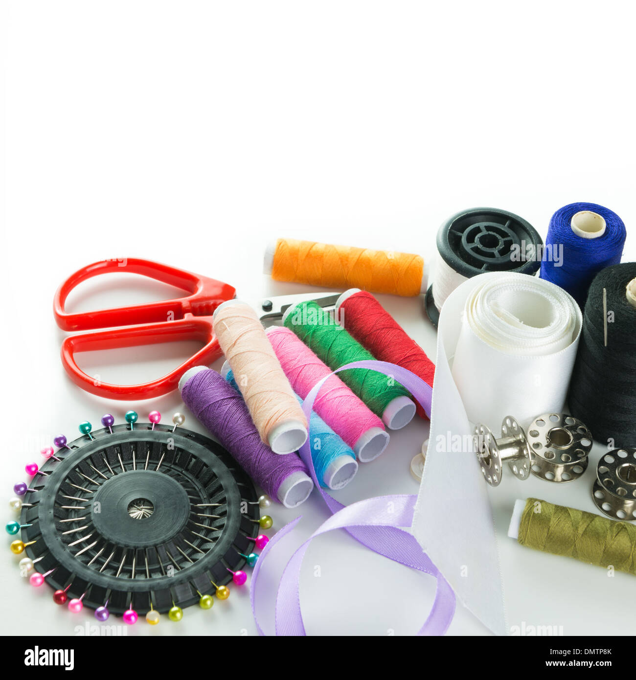 Close-up image of sewing stuff over white background Stock Photo - Alamy