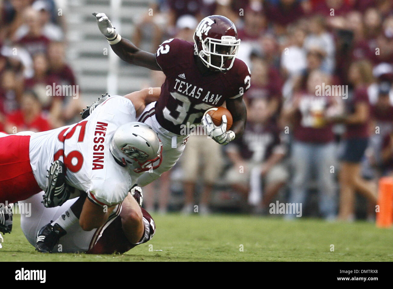 Cyrus Gray (#32) of the Texas A&M University Aggies attempts to evade ...