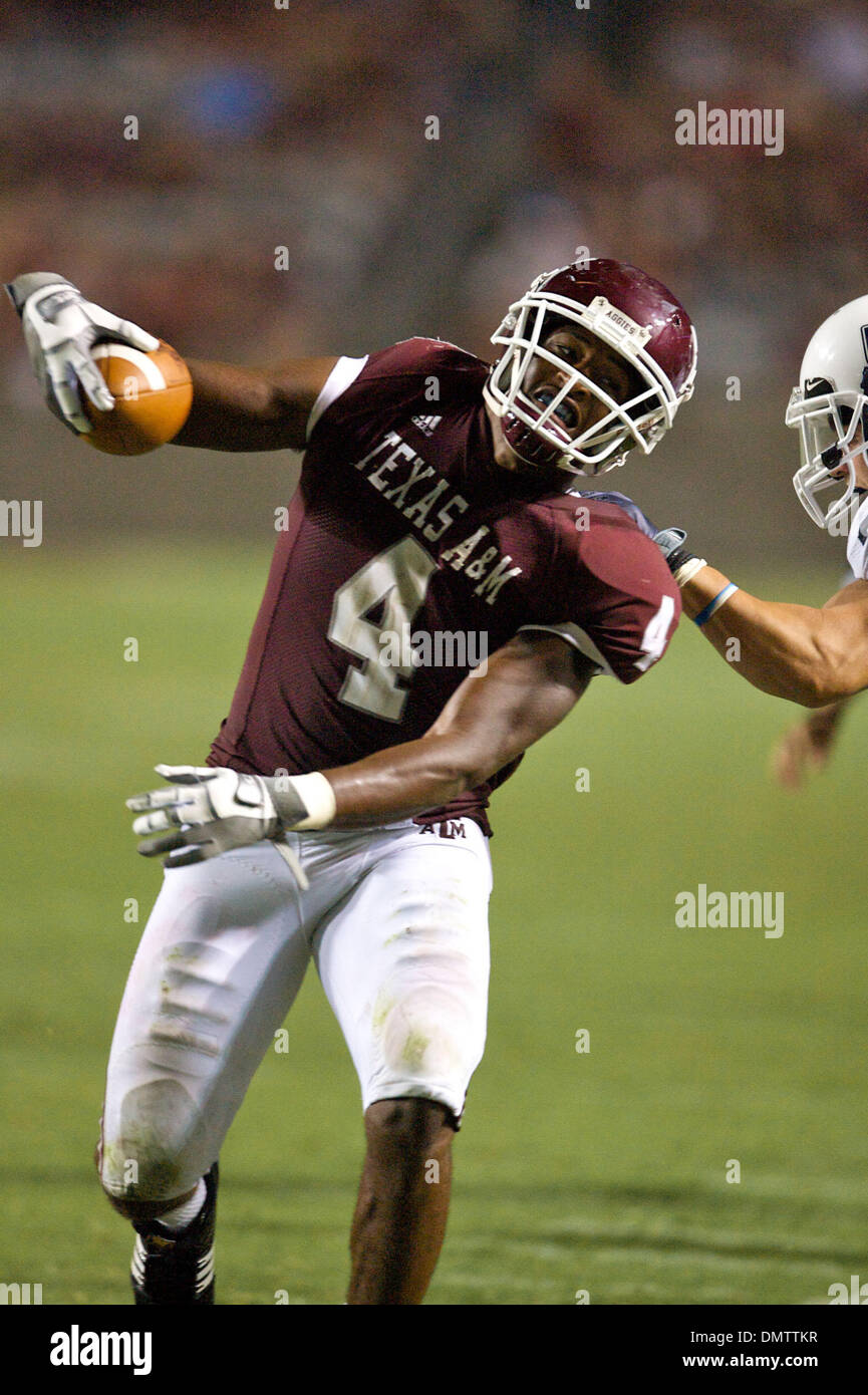 Jamie McCoy (#4) of the Texas A&M University Aggies is brought down ...