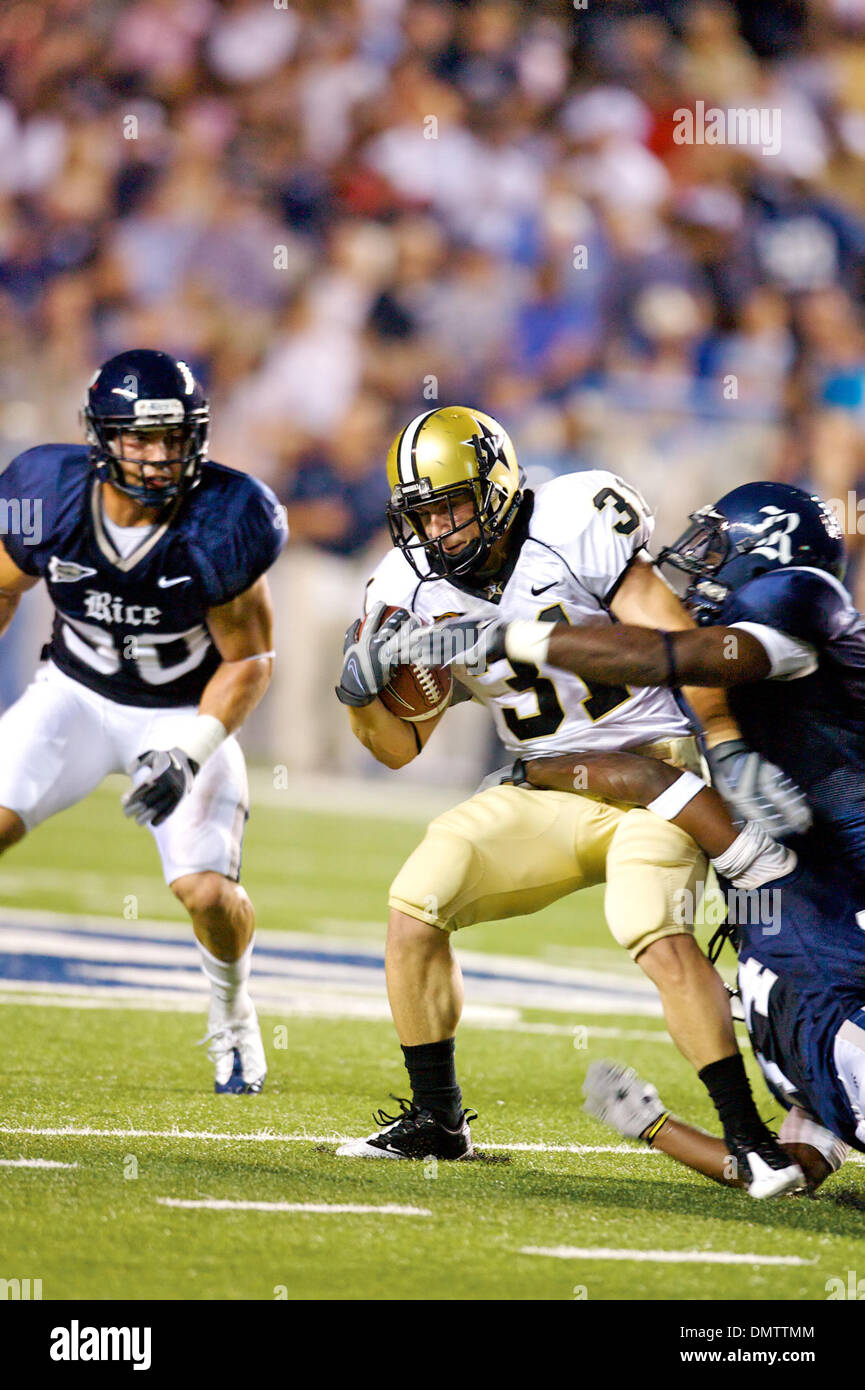 Jared Hawkins (#31) of the Vanderbilt Commodores is brought down by ...