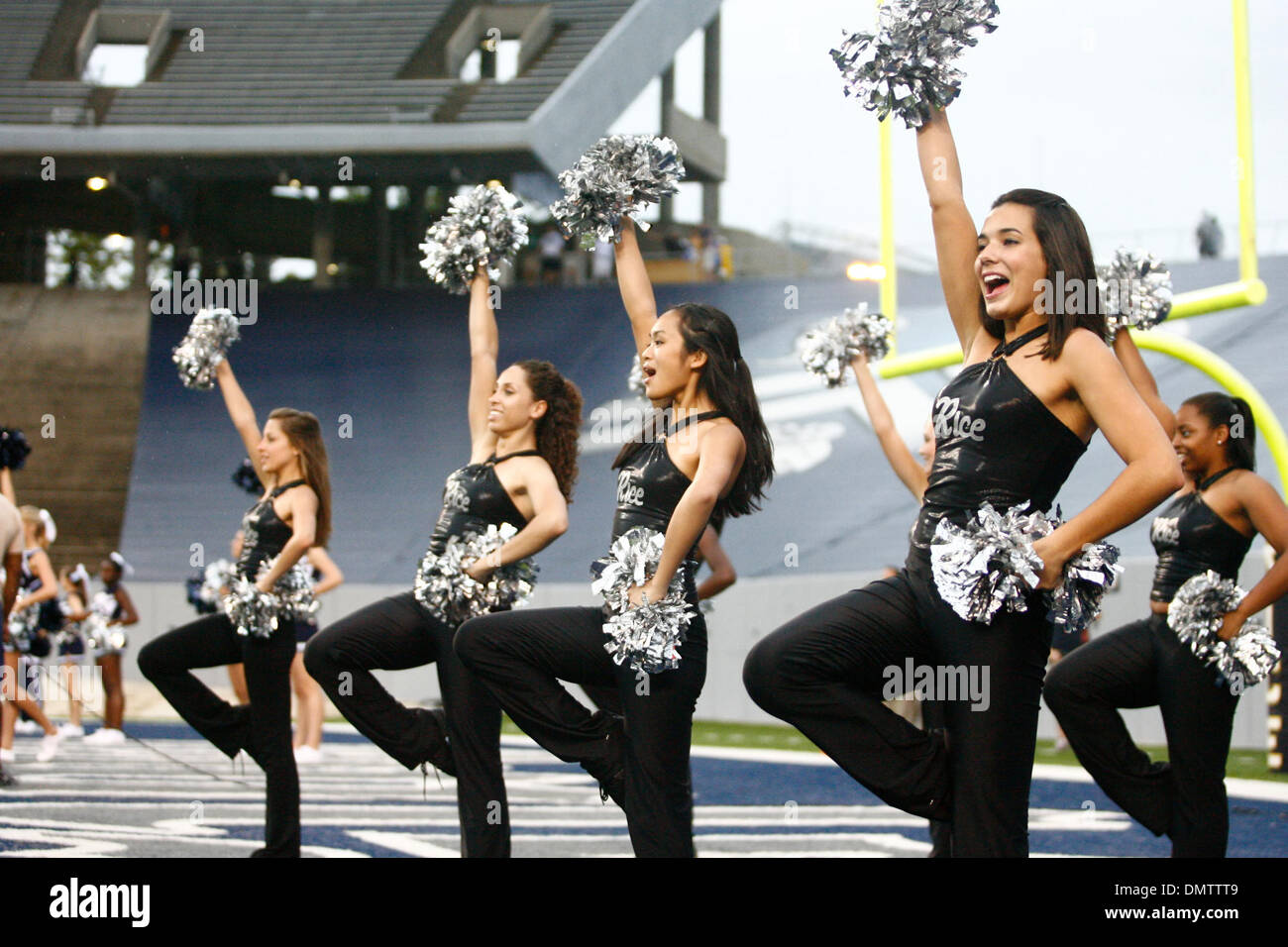 Members of the Rice Dance Team pump up the crowd prior to the team ...