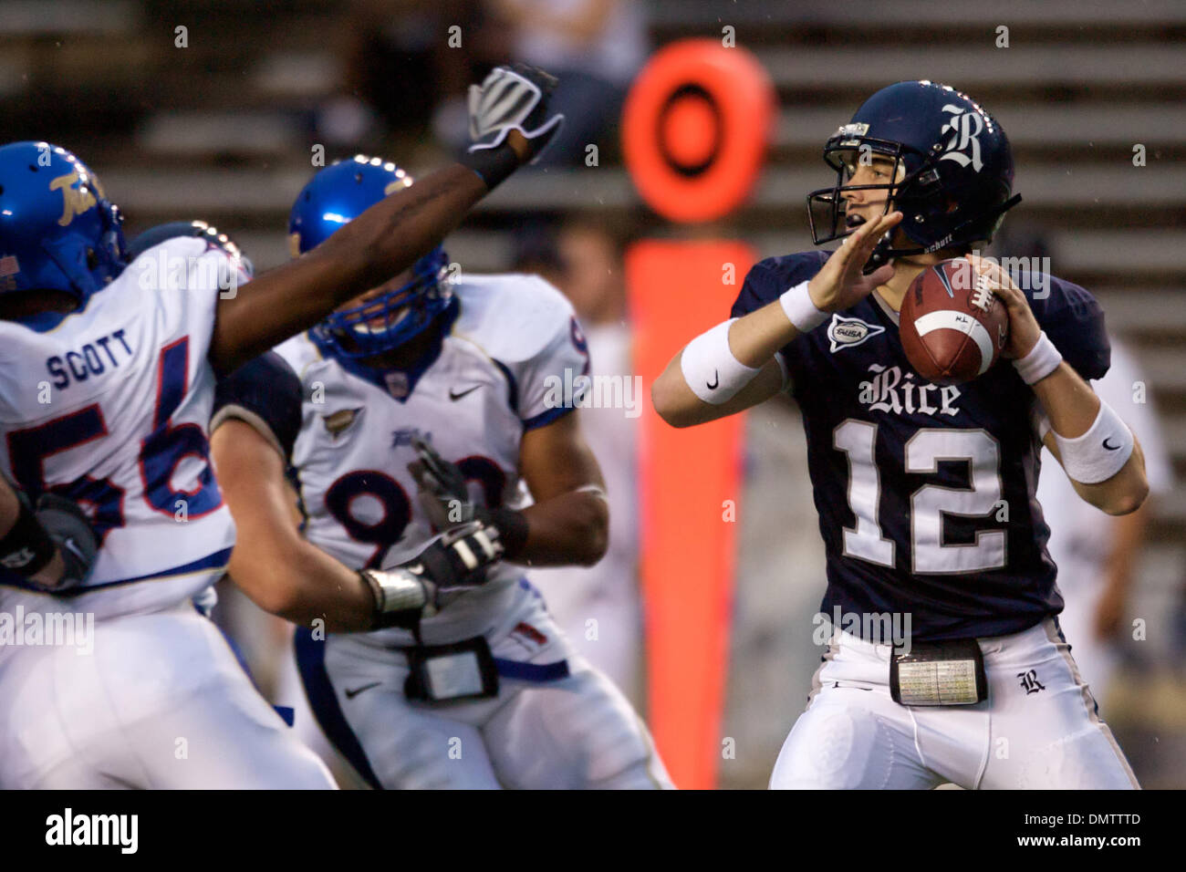 Ryan Lewis (#12) of the Rice Owls looks for an open receiver downfield ...