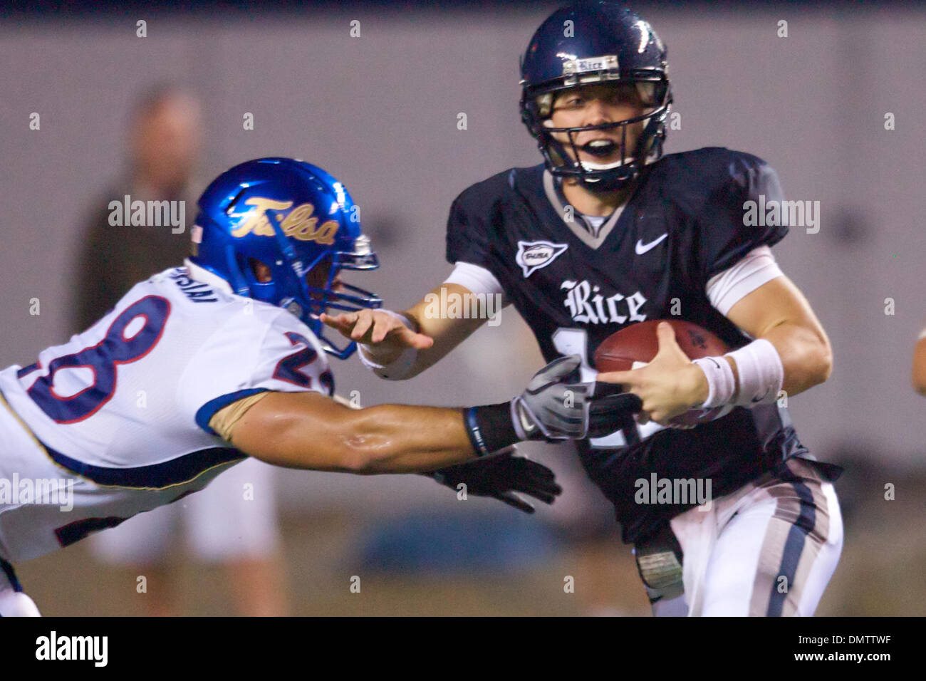 John Shepherd Thomas (#17) of the Rice Owls is pursued by Kaipo ...