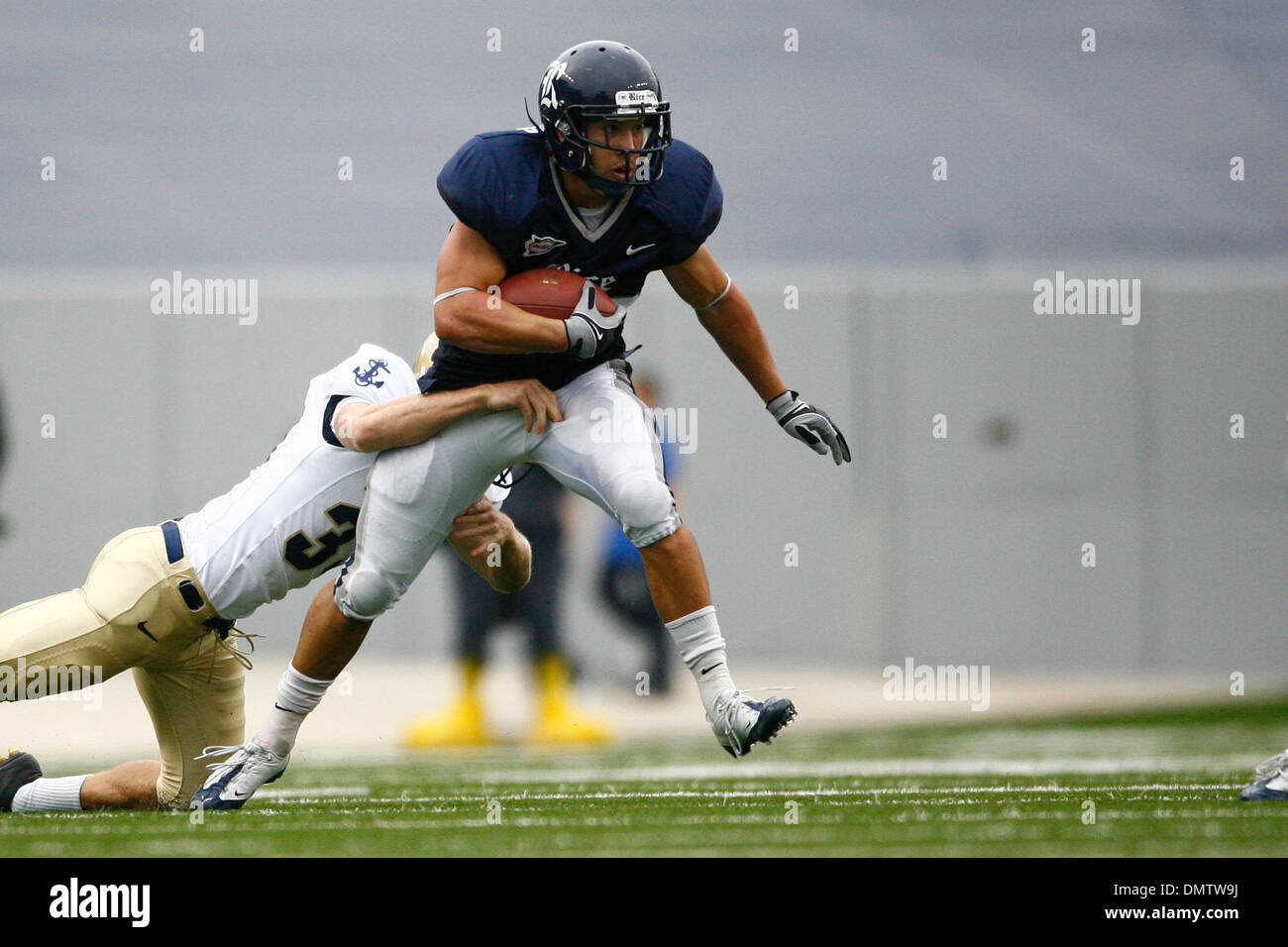 Andrew Sendejo (#30) of the Rice Owls is bought down by Jarred Mack ...