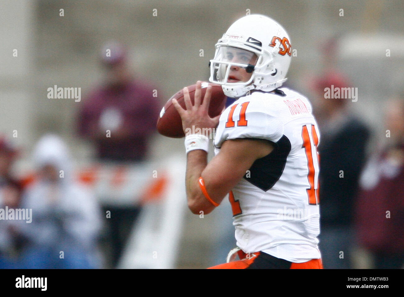 Zac Robinson (#11) of the Oklahoma State University Cowboys looks ...