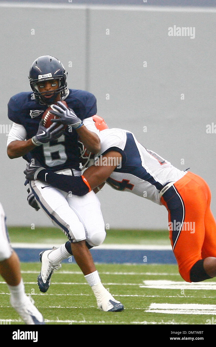 Patrick Randolph (#6) of the Rice Owls is brought down by Braxton Amy ...