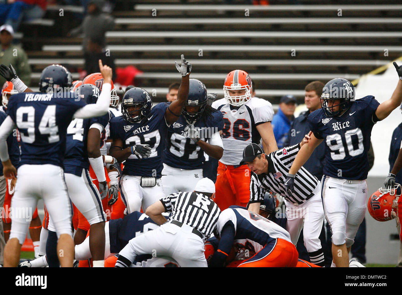 Marcus Knox (#27) of the Rice Owls and Cody Bauer (#90) of the Rice ...