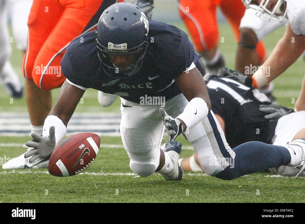 Xavier Webb (#14) of the Rice Owls pursues a loose ball resulting from ...