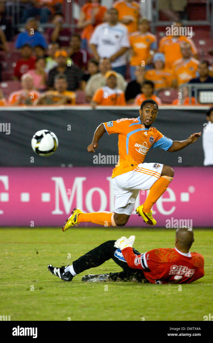 Corey Ashe (#26) Midfielder of the Houston Dynamo chips the ball to the ...