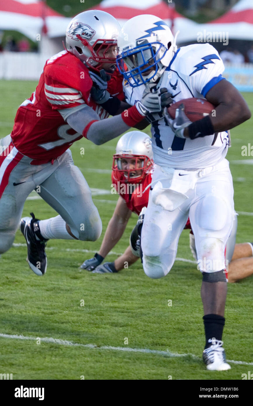 Air Force Academy quarter back and running back Asher Clark (17) trying ...
