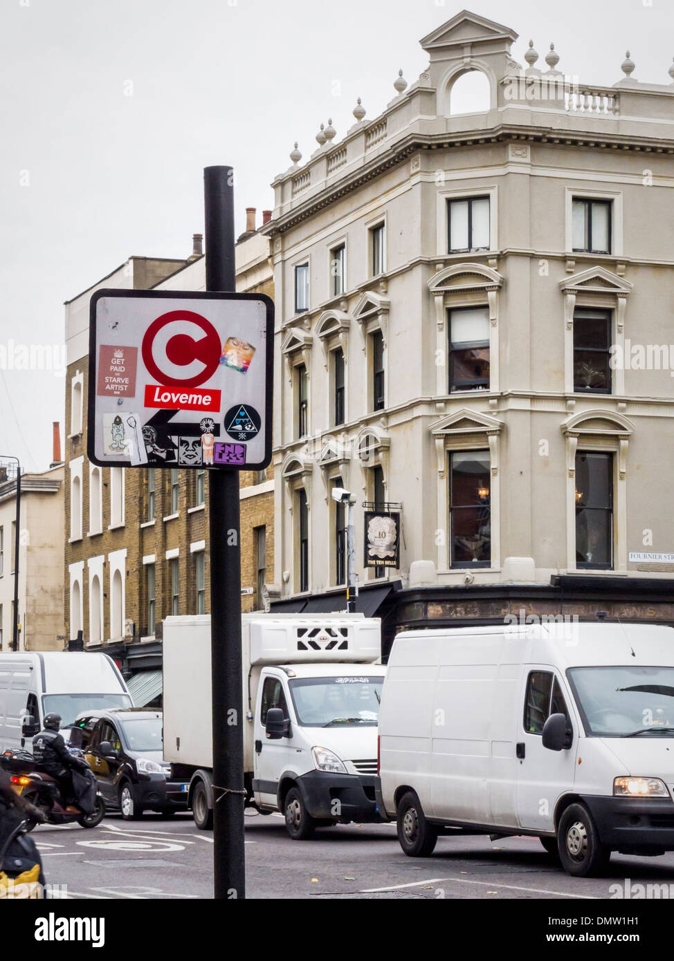 Red and white congestion zone traffic sign defaced with stickers ...