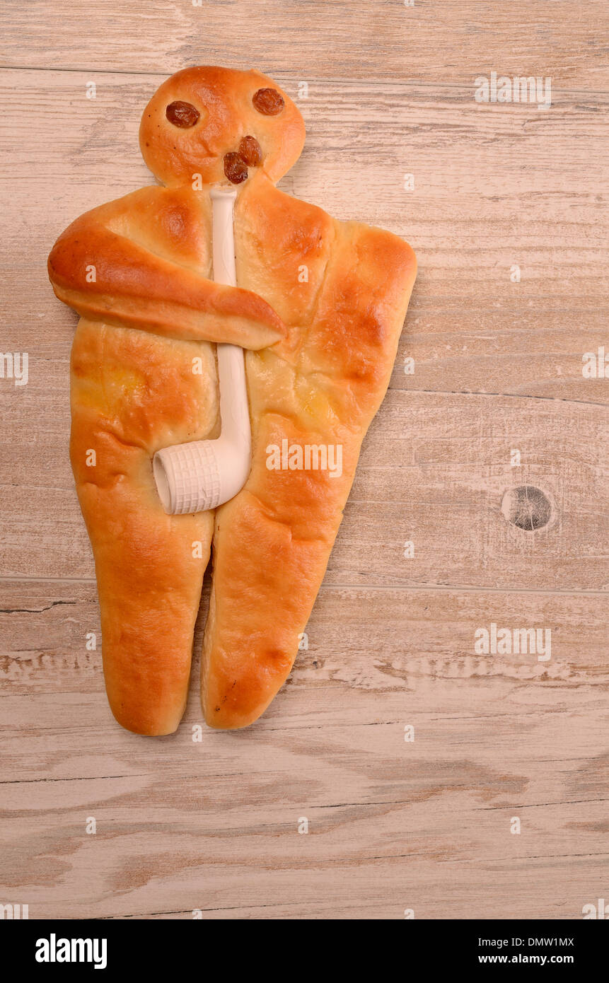 Raising bread man on a rustic wooden background Stock Photo - Alamy
