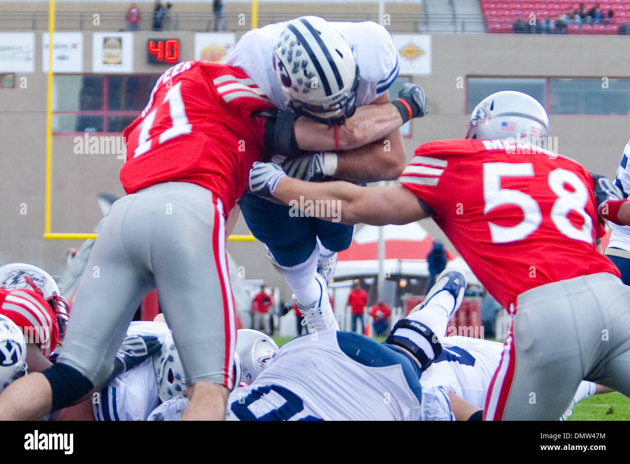 BYU Running Back Manase Tonga (11) leaps for the in zone while ...
