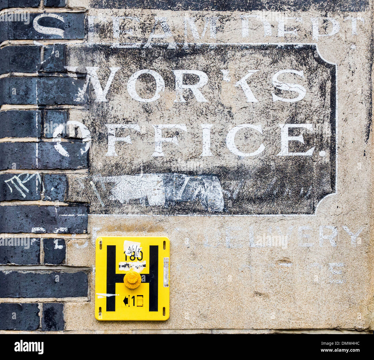 "Steam Dept. Works Office" - Old sign on wall of brick building in ...