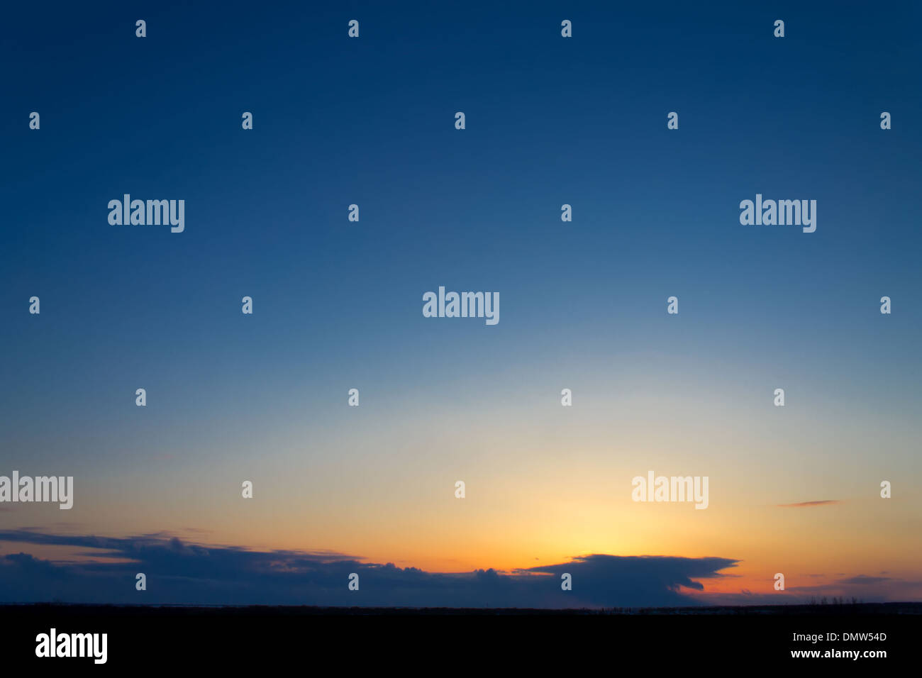 Sunset background with clear deep blue sky Stock Photo - Alamy
