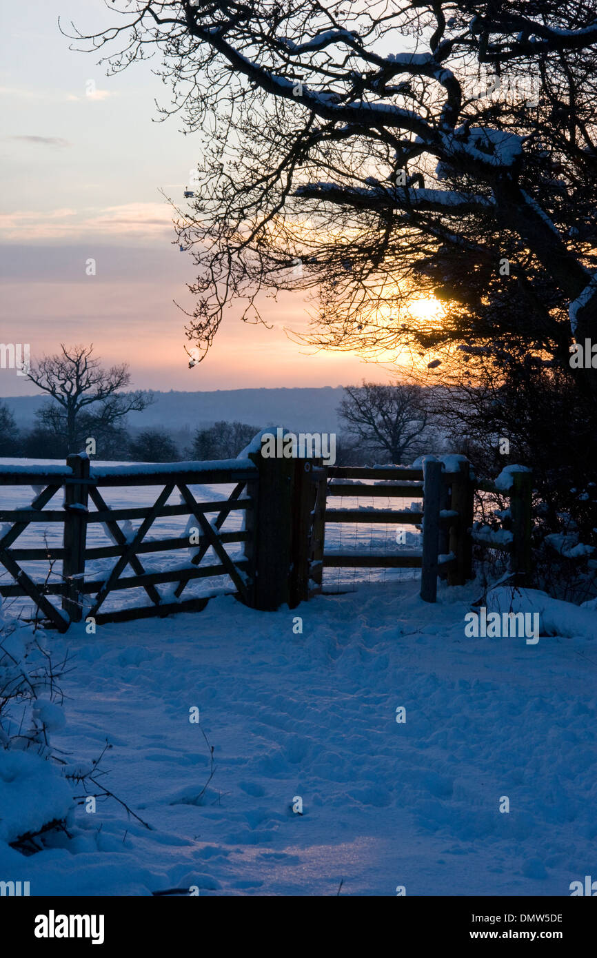 Sunrise on snow-covered fields Stock Photo - Alamy