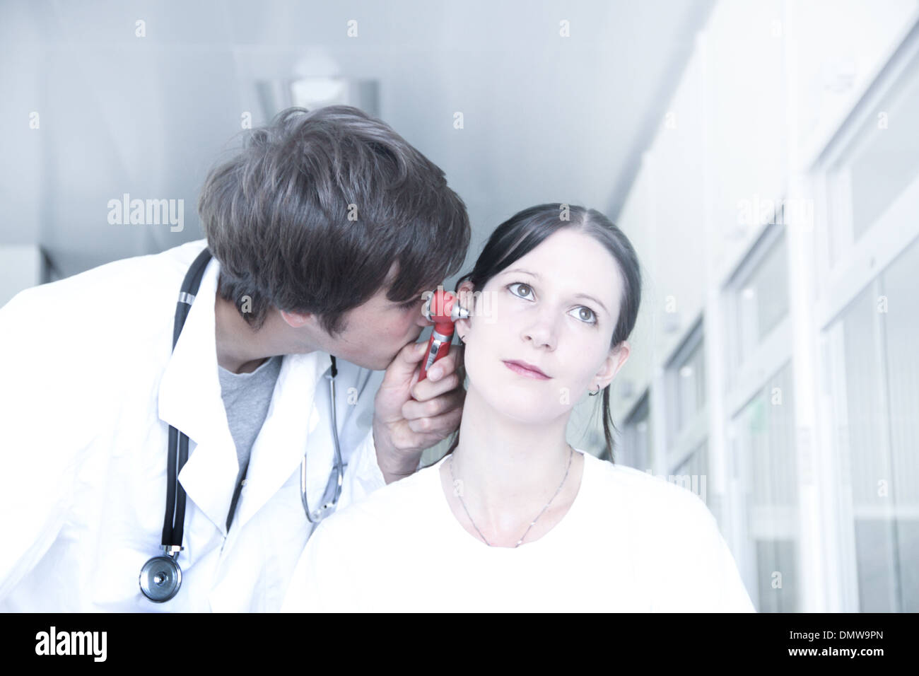 doctor examines a patient with stethoscope Stock Photo - Alamy