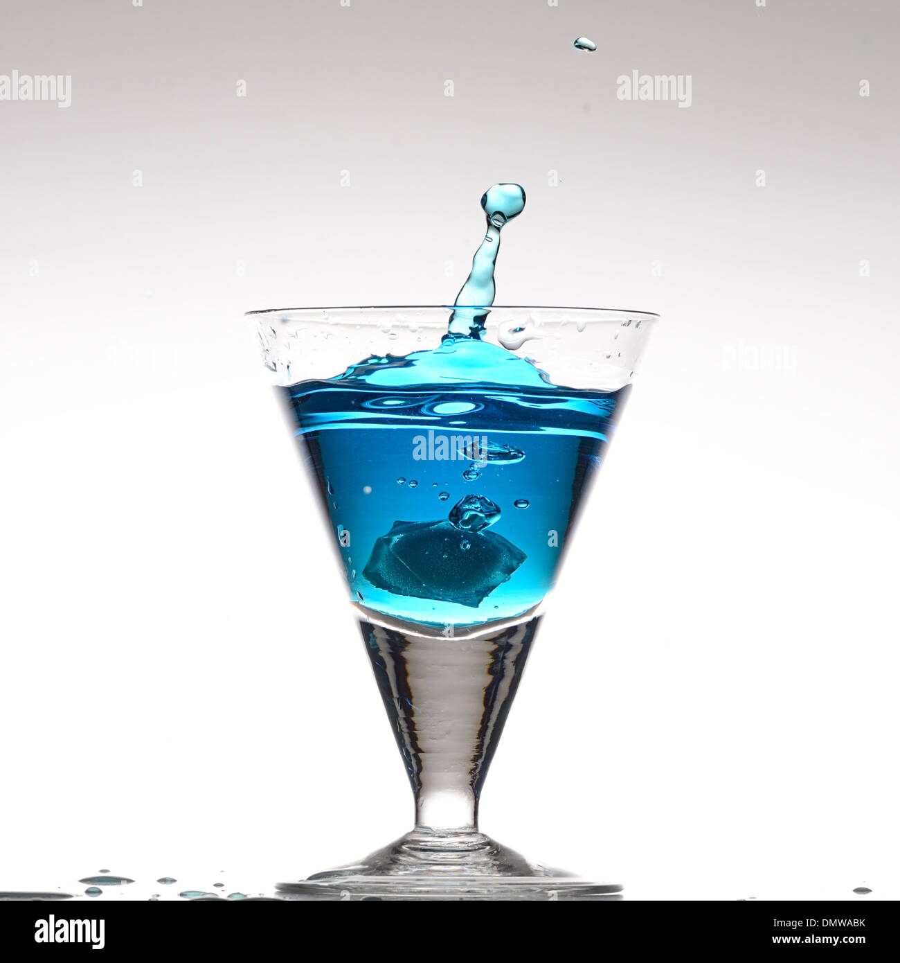 Splashing blue cocktail Stock Photo - Alamy
