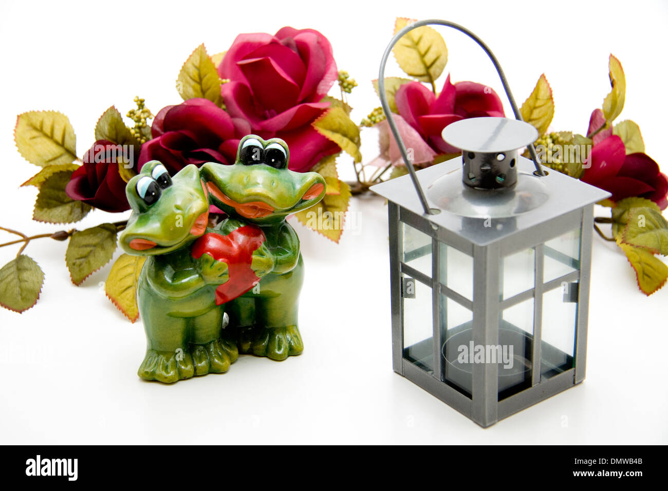 Tea light lantern with frog pair Stock Photo - Alamy