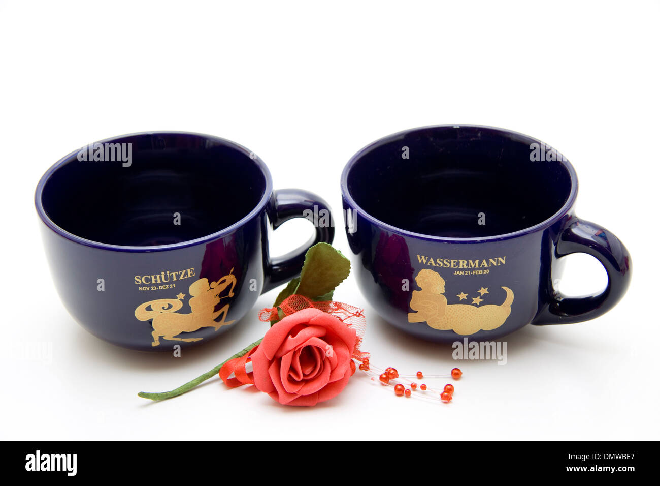 Porcelain cups with rose Stock Photo - Alamy